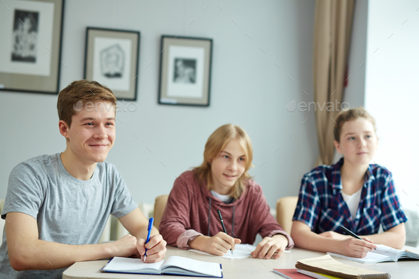 Learners at lesson Stock Photo by Pressmaster | PhotoDune
