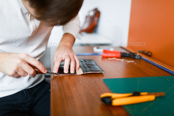 Making wallets Stock Photo by Pressmaster | PhotoDune