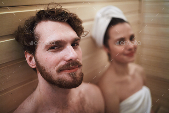 Couple in sauna Stock Photo by Pressmaster | PhotoDune