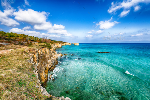 white rocky cliffs, sea bay, islets and faraglioni near by beach ...