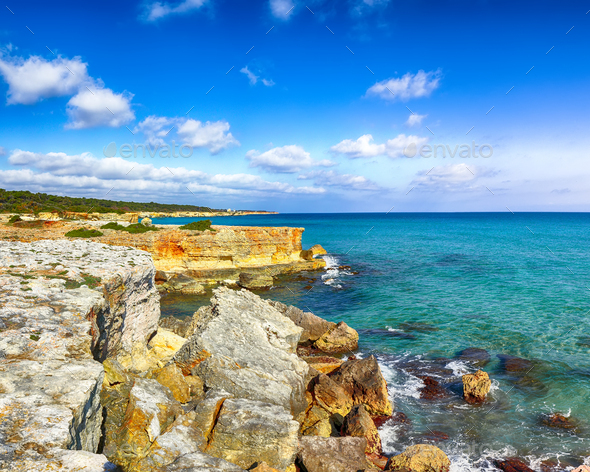 white rocky cliffs, sea bay, islets and faraglioni near by Conca ...