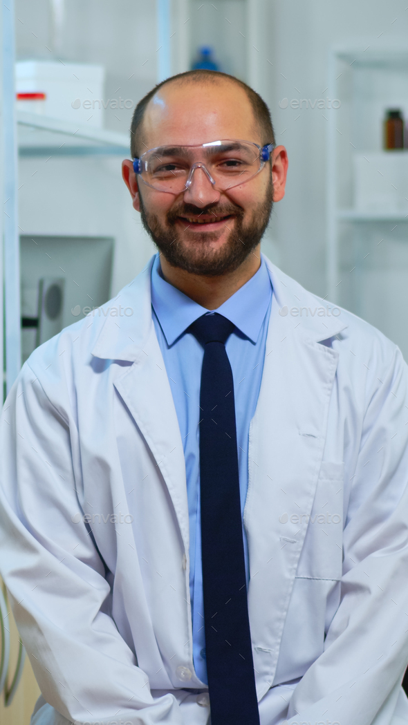 Experienced man scientist looking at camera smiling Stock Photo by DC ...