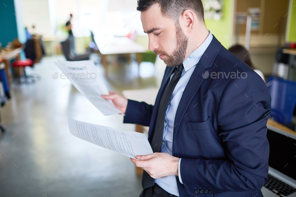 Reading documents Stock Photo by Pressmaster | PhotoDune