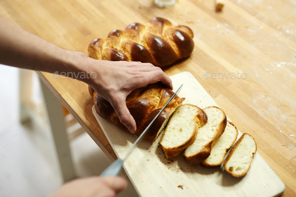 Cutting fresh bread Stock Photo by Pressmaster | PhotoDune