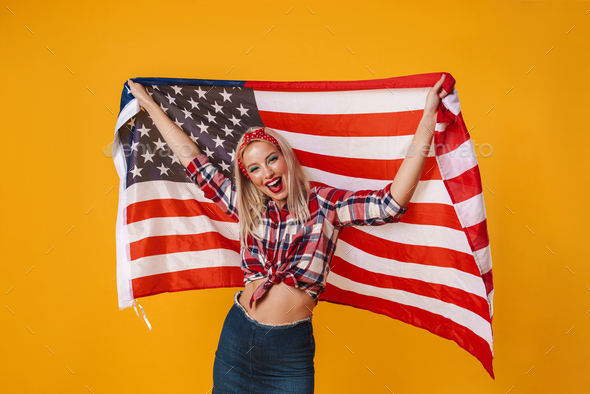 Image of happy pinup girl posing with american flag and smiling Stock ...