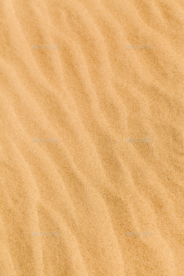 Yellow desert sand with diagonal wave patern Stock Photo by Stramyk