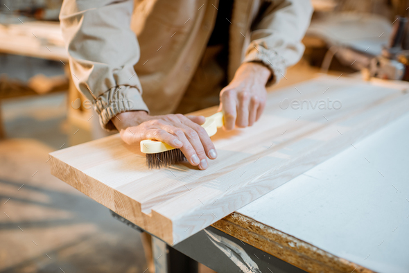 Brushing wood with hand brush Stock Photo by RossHelen | PhotoDune