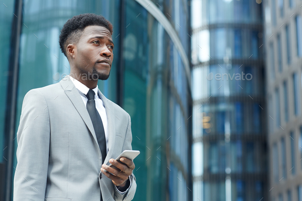 Employee with smartphone Stock Photo by Pressmaster | PhotoDune