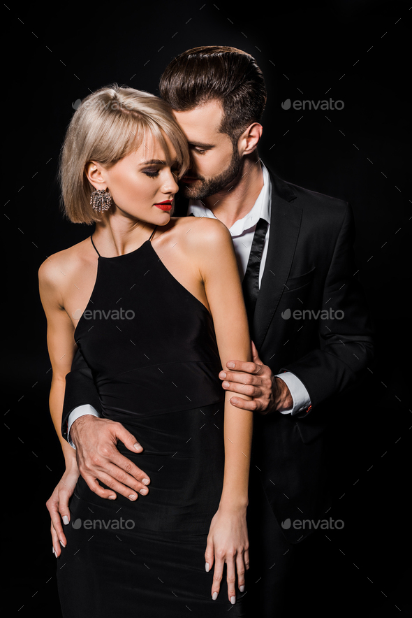 handsome boyfriend hugging seductive glamour girlfriend isolated on ...