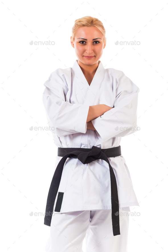 Woman posing in karate stand on white background Stock Photo by ...
