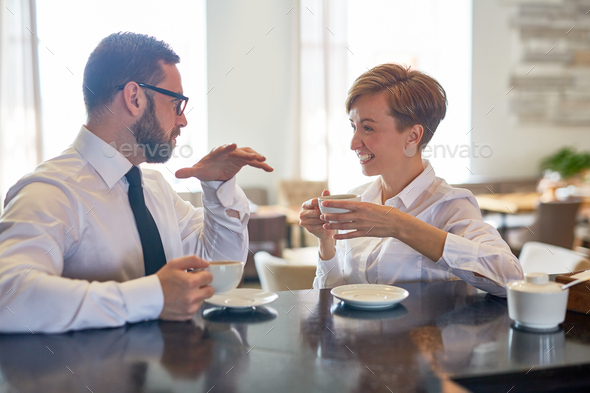 Conversation in cafe Stock Photo by Pressmaster | PhotoDune