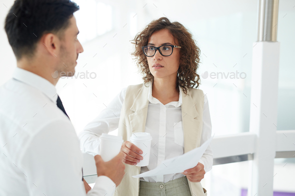 Employees talking Stock Photo by Pressmaster | PhotoDune