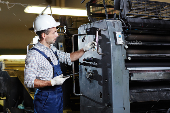 Industrial machine service Stock Photo by Pressmaster | PhotoDune