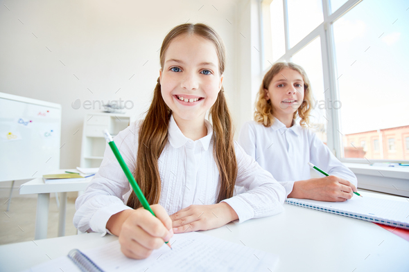 Classmates drawing Stock Photo by Pressmaster | PhotoDune