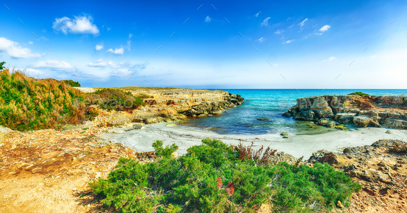 white rocky cliffs, sea bay, islets and faraglioni near by Conca ...