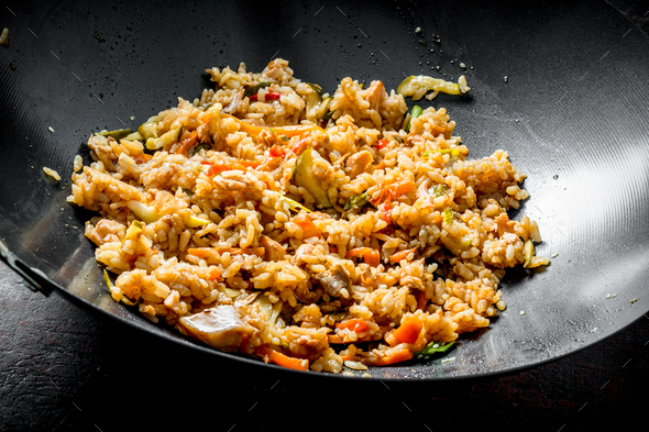 Chinese wok. Rice with beef and vegetables. Stock Photo by Artem_ka2
