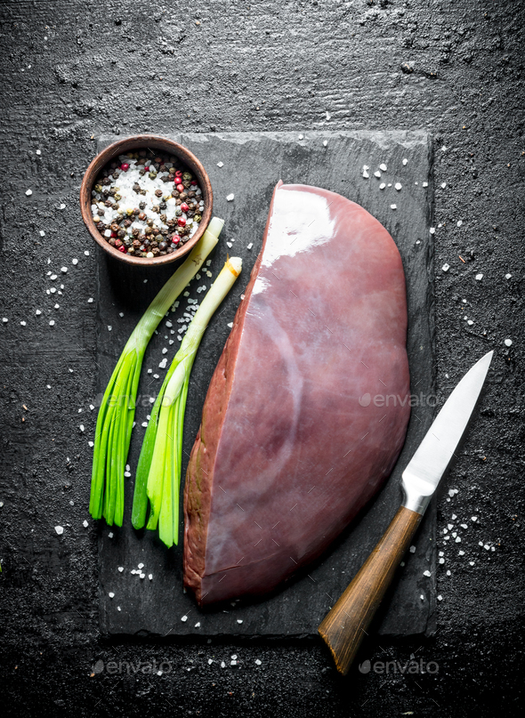 Fresh liver with spices and green onions. Stock Photo by Artem_ka2