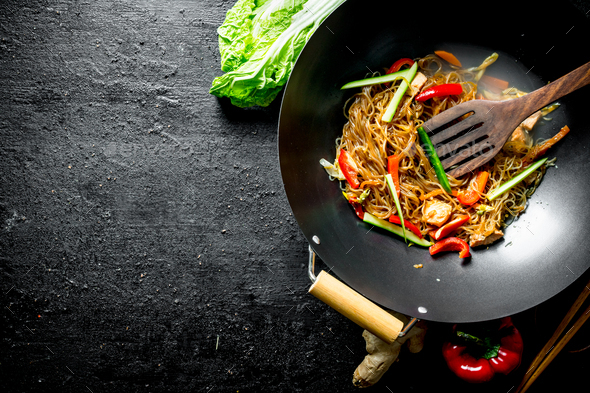 Fragrant Chinese funchoza with fresh vegetables. Stock Photo by Artem_ka2
