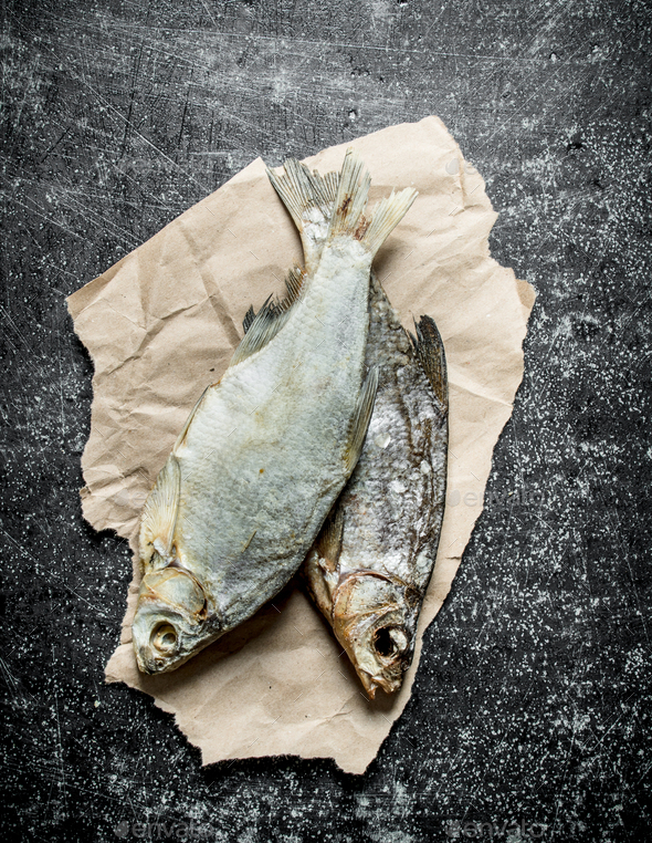 Dried fish on paper. Stock Photo by Artem_ka2 | PhotoDune