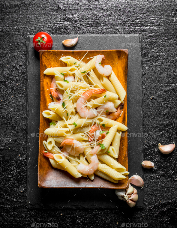 Pasta with shrimp and garlic slice. Stock Photo by Artem_ka2 | PhotoDune