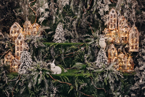 Christmas scene of animals, birds and houses. Stock Photo by StudioLucky