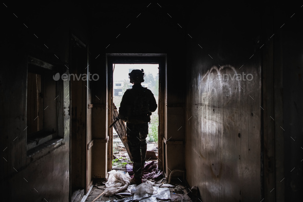 Military men with arms defending the building. Soldier stand guard ...