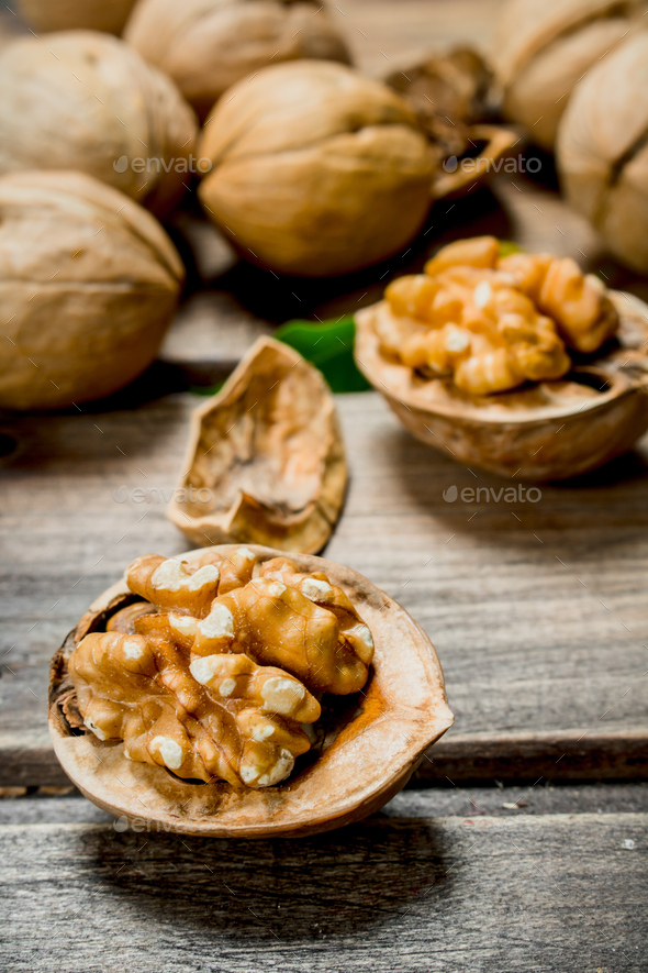 Shelled walnut with green leaves. Stock Photo by Artem_ka2 | PhotoDune