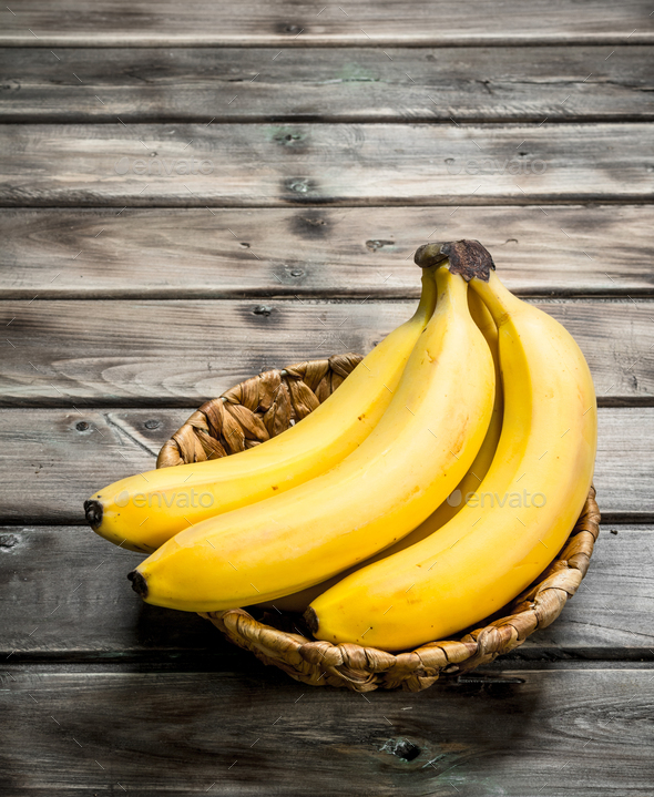 Bunch of bananas in the basket. Stock Photo by Artem_ka2 | PhotoDune