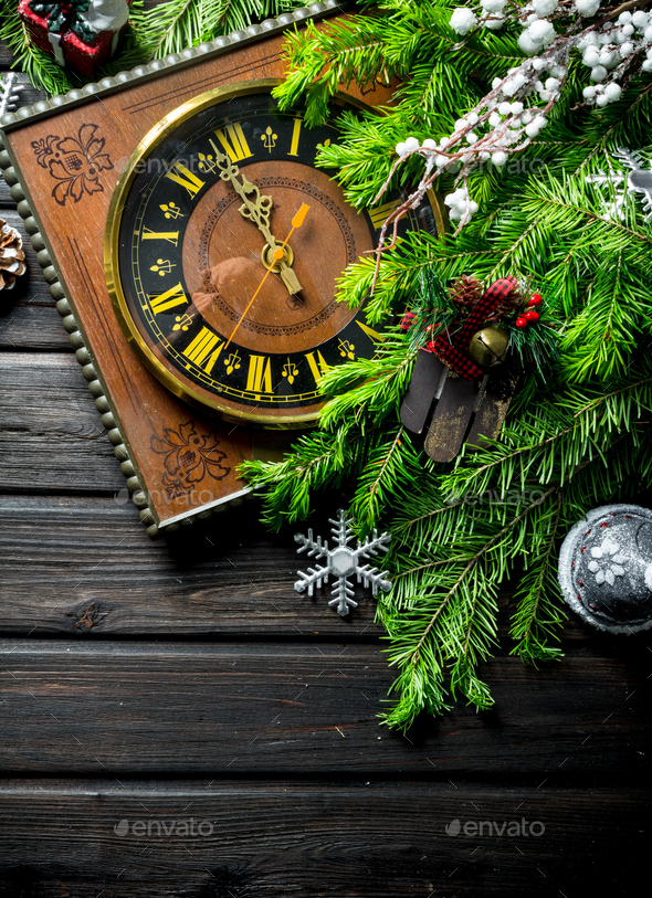 Retro clock with Christmas tree branches and decorations. Stock Photo ...
