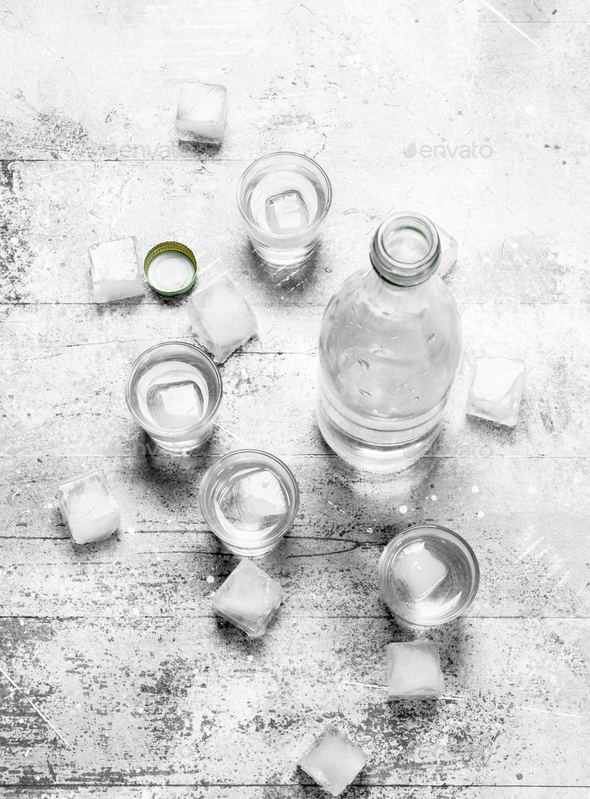 Vodka in a bottle and ice cubes. Stock Photo by Artem_ka2 | PhotoDune