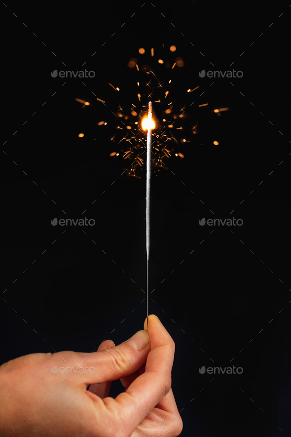 Sparkling Stick Isolated on Black Background Stock Photo by microgen