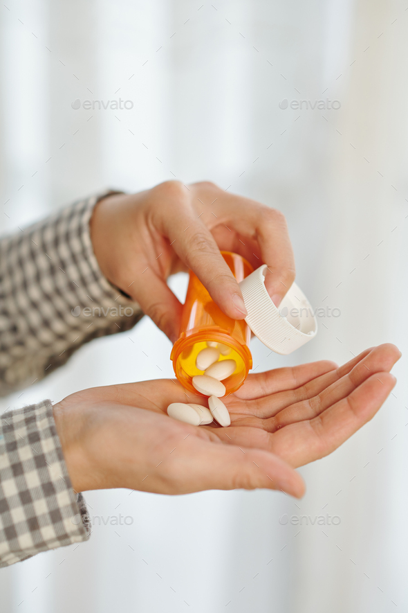 Patient taking tablets Stock Photo by DragonImages | PhotoDune