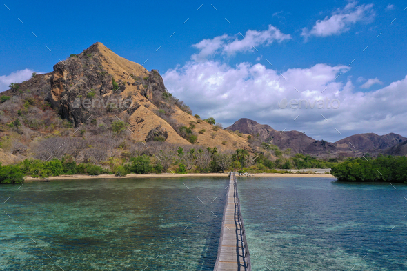 Bridge over the transparent sea water at Labuan Bajo Indonesia Stock ...