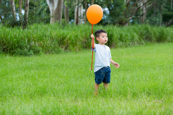 Little boy catch with balloon Stock Photo by leungchopan | PhotoDune