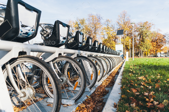 Modern street bike parking, copy space on bicycle Stock Photo by diignat