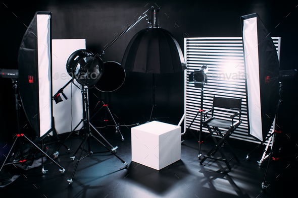 Modern photo studio with professional equipment. Black cyclorama. Stock ...