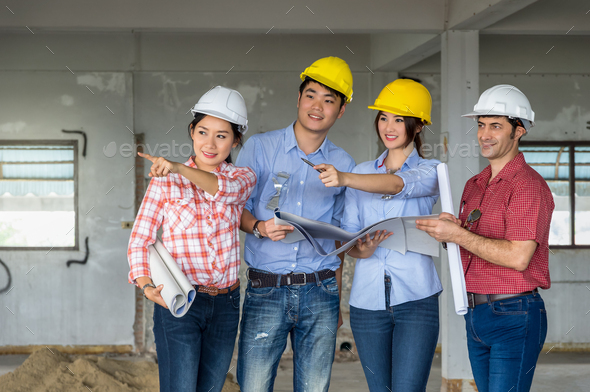 Multiethnic professional construction engineers working with Corporate Colleagues Teamwork Stock ...