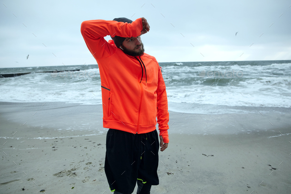 sportsman being tired after morning exercises by the sea Stock Photo by ...