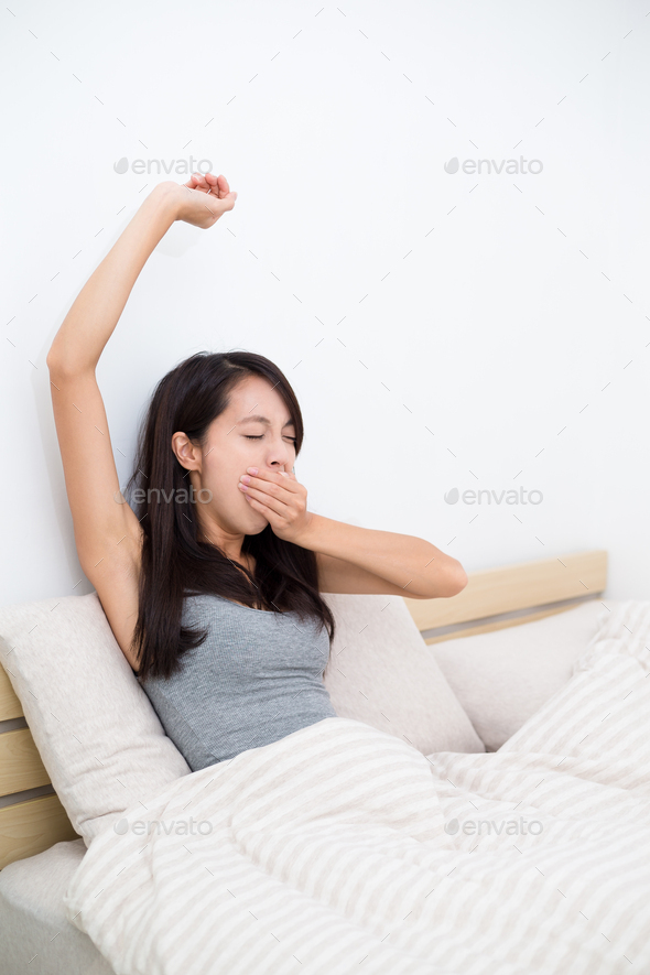 Woman just wake up and yawning Stock Photo by leungchopan | PhotoDune