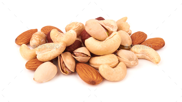 Heap of mixed nuts isolated on white background Stock Photo by pioneer111