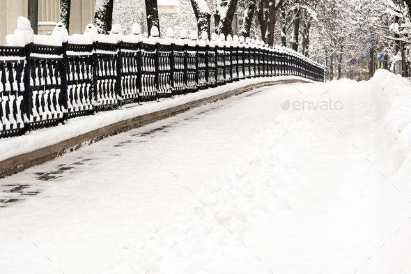 Snow-covered park in the center of Minsk. Belarus Stock Photo by Lobachad