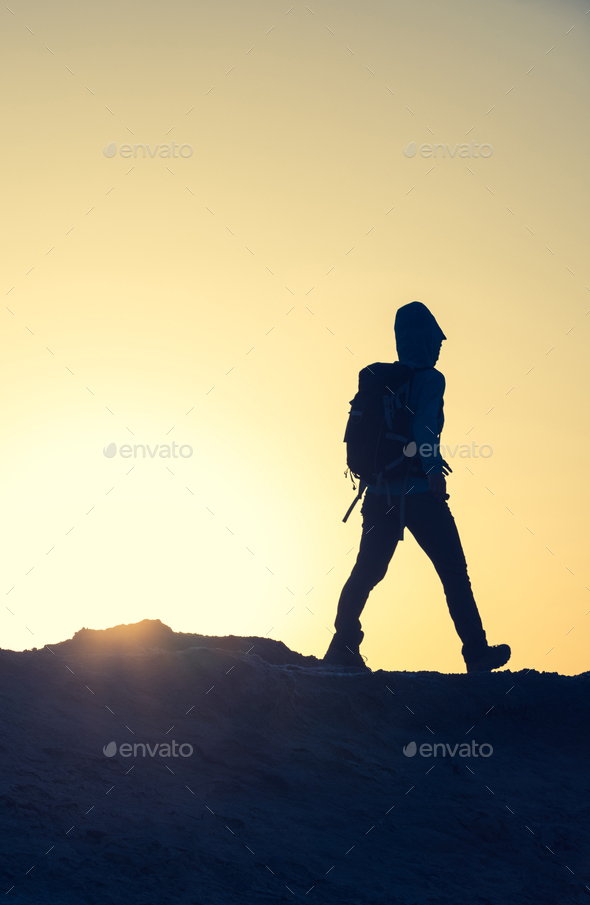 Backpacker hking on sunset desert Stock Photo by lzf | PhotoDune