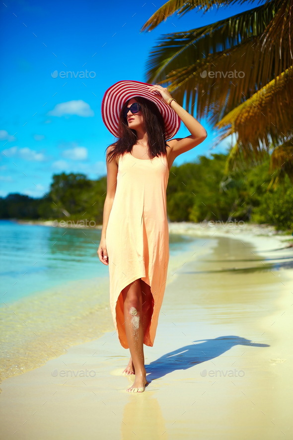 Portrait of beautiul woman posing at the beach Stock Photo by halayalex