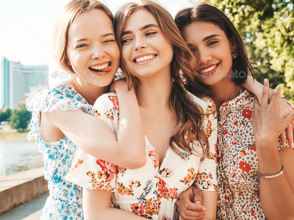 Portrait of three young beautiful women posing outdoors Stock Photo by ...