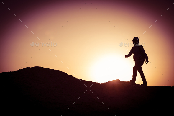 Backpacker hking on sunset desert Stock Photo by lzf | PhotoDune