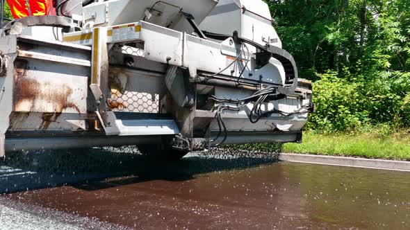 Heavy Machinery Resurfacing a Road Using Micro Asphalt Dressing, Stock ...