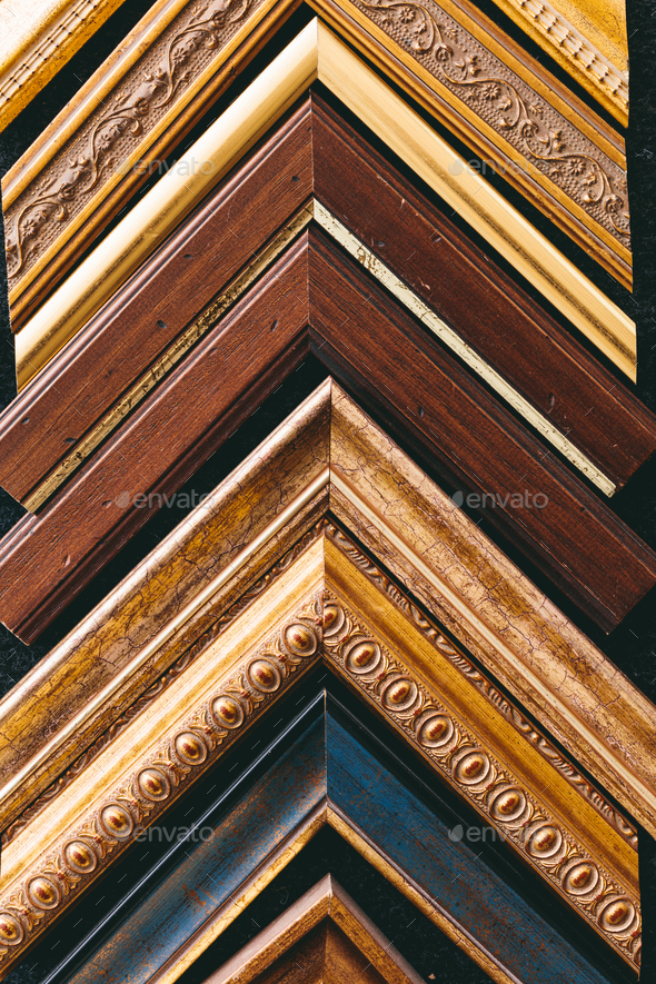 Wooden picture frames on wall in a store, background Stock Photo by ...