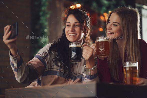 Girls in pub Stock Photo by djoronimo | PhotoDune