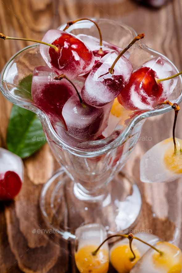 Cherry in ice cube in glass bowl Stock Photo by ipolly80 | PhotoDune