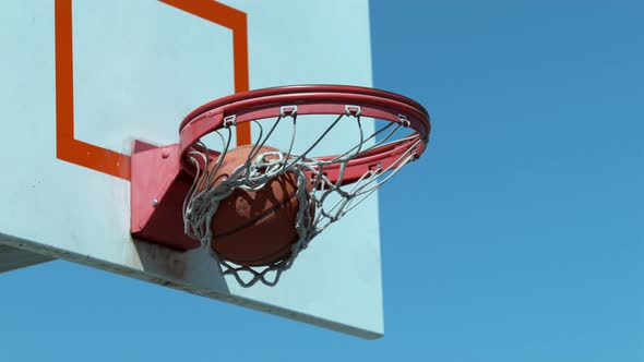 Super slow motion shot of basketball going into hoop, shot on Phantom ...